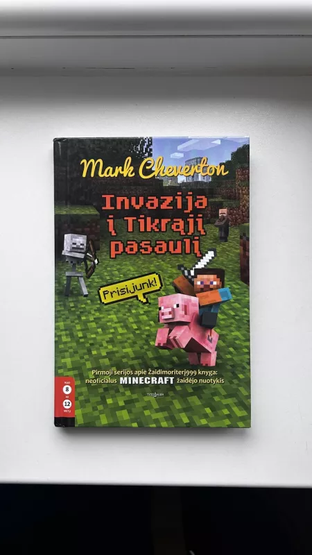 Invaziją į Tikrąjį pasaulį. Pirmoji serijos apie Žaidimoriterį999 knyga ...